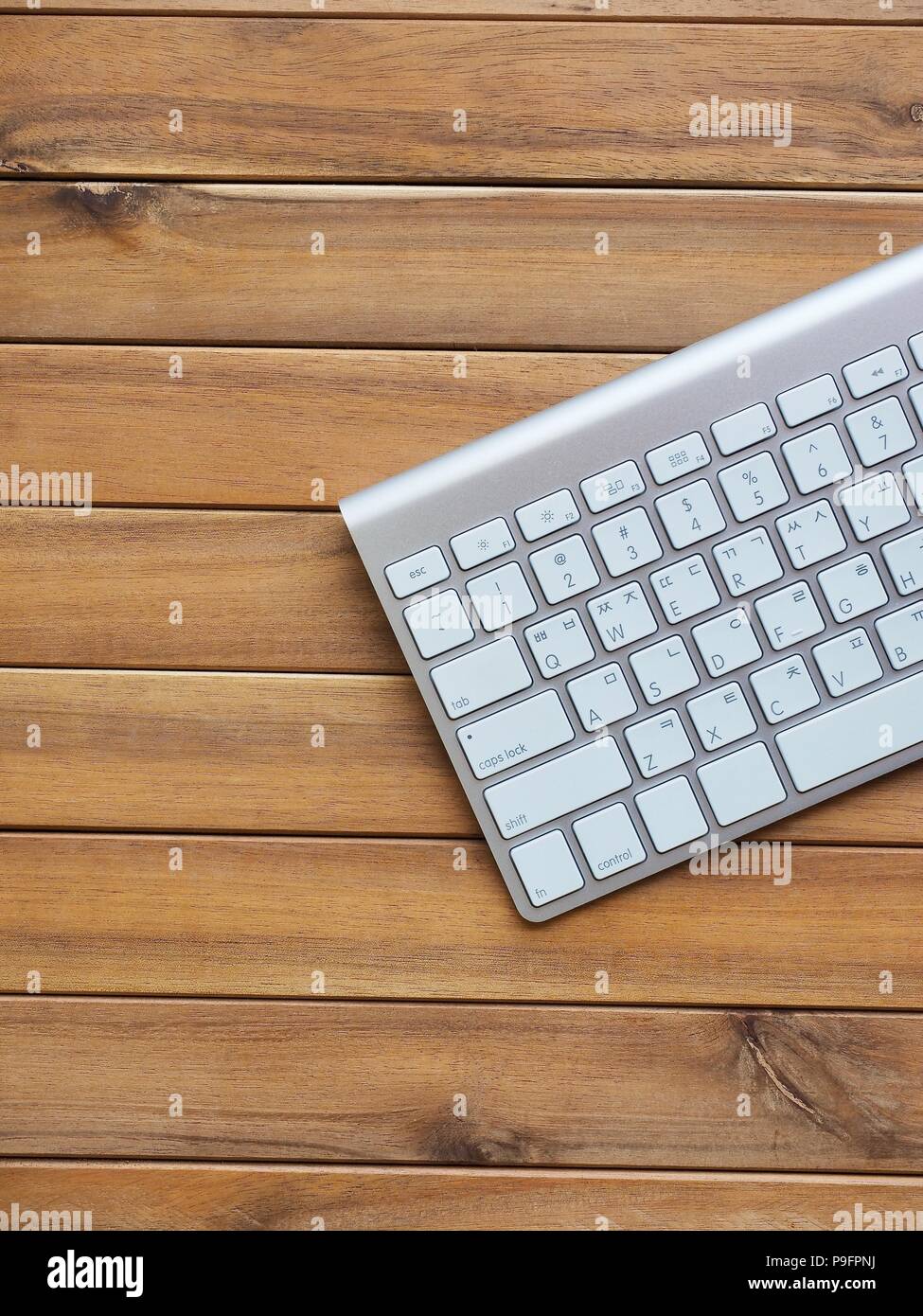 Wooden board with white keyboard Stock Photo - Alamy