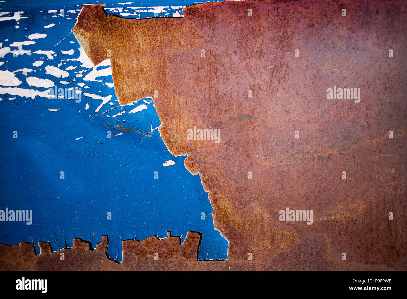 close up blue color and old rusty surface background as ocean and earth ...