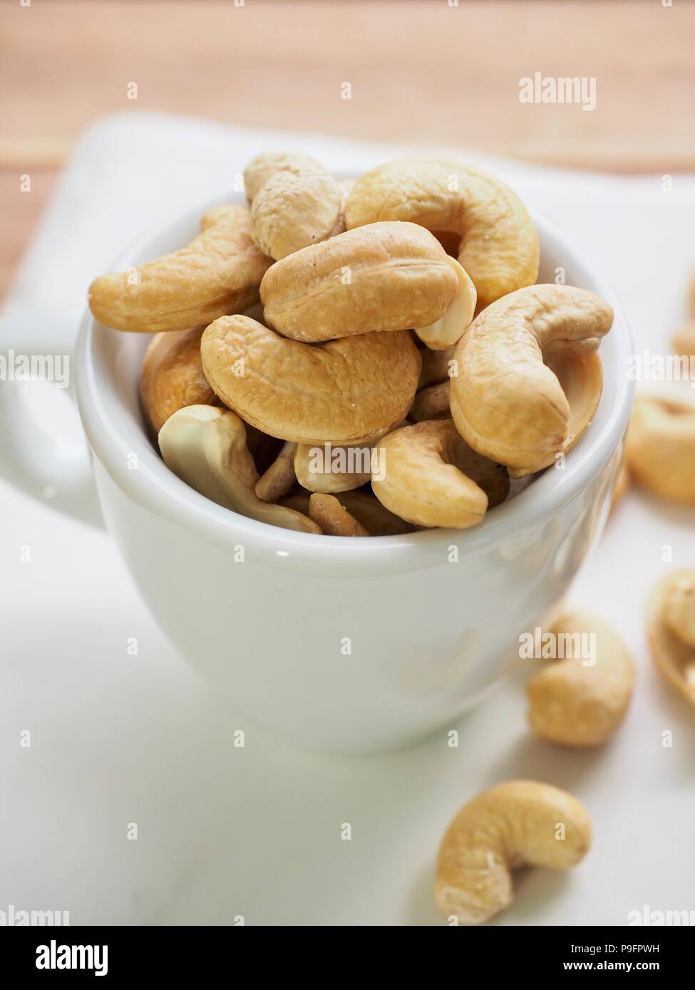 Cashew nuts in a coffee cup Stock Photo - Alamy
