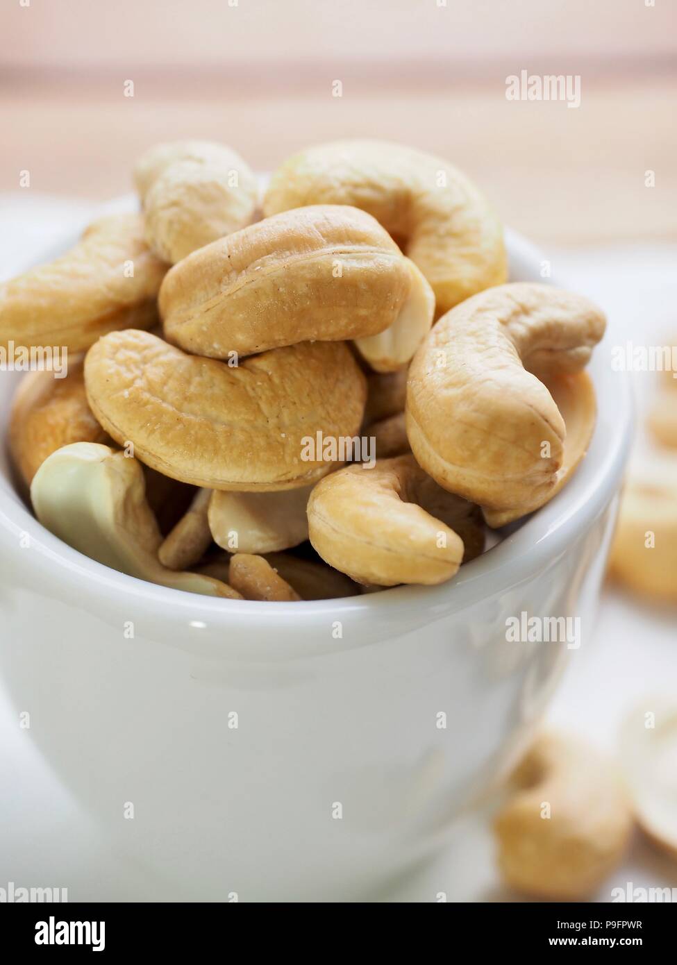 Cashew nuts in a coffee cup Stock Photo - Alamy