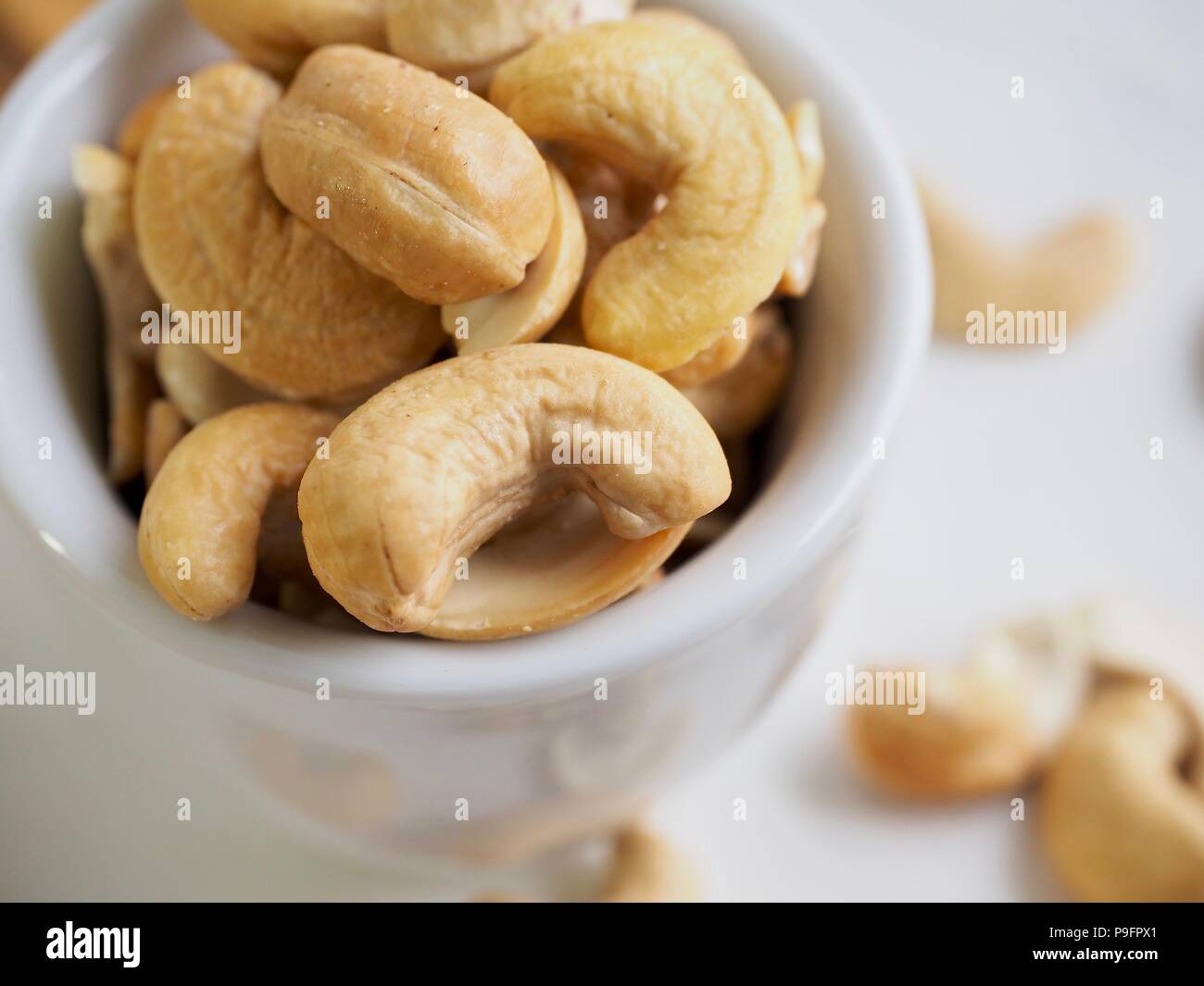 Cashew nuts in a coffee cup Stock Photo - Alamy