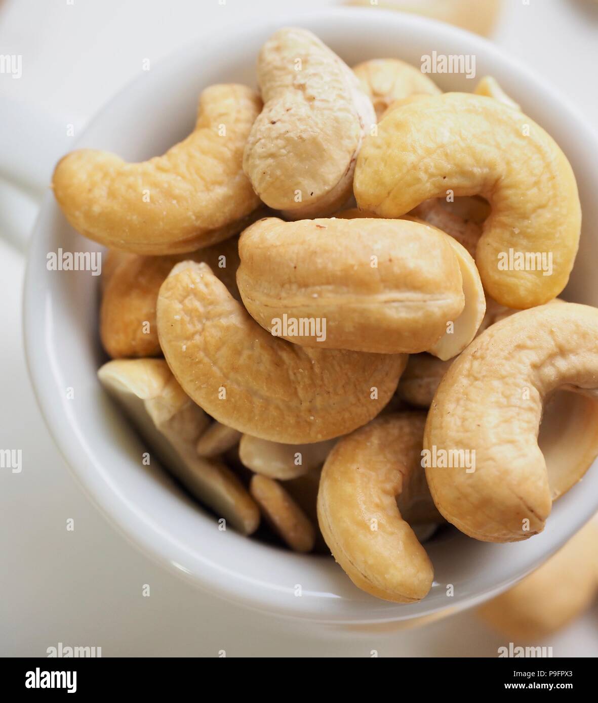 Cashew nuts in a coffee cup Stock Photo - Alamy