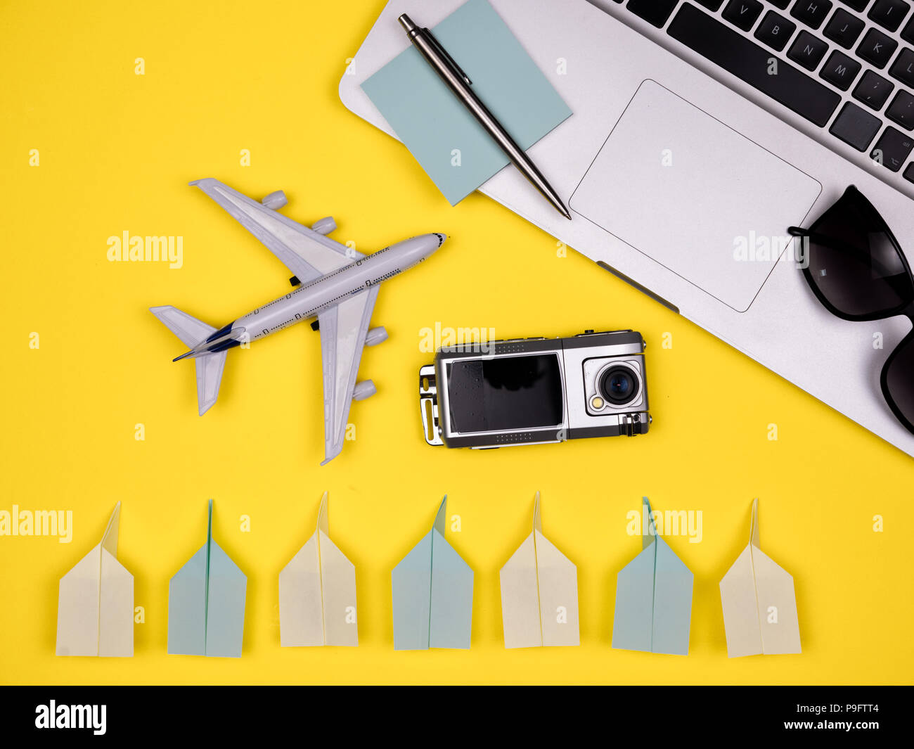 Laptop, plane, camera, pen, notes, keyboard and paper planes Stock ...