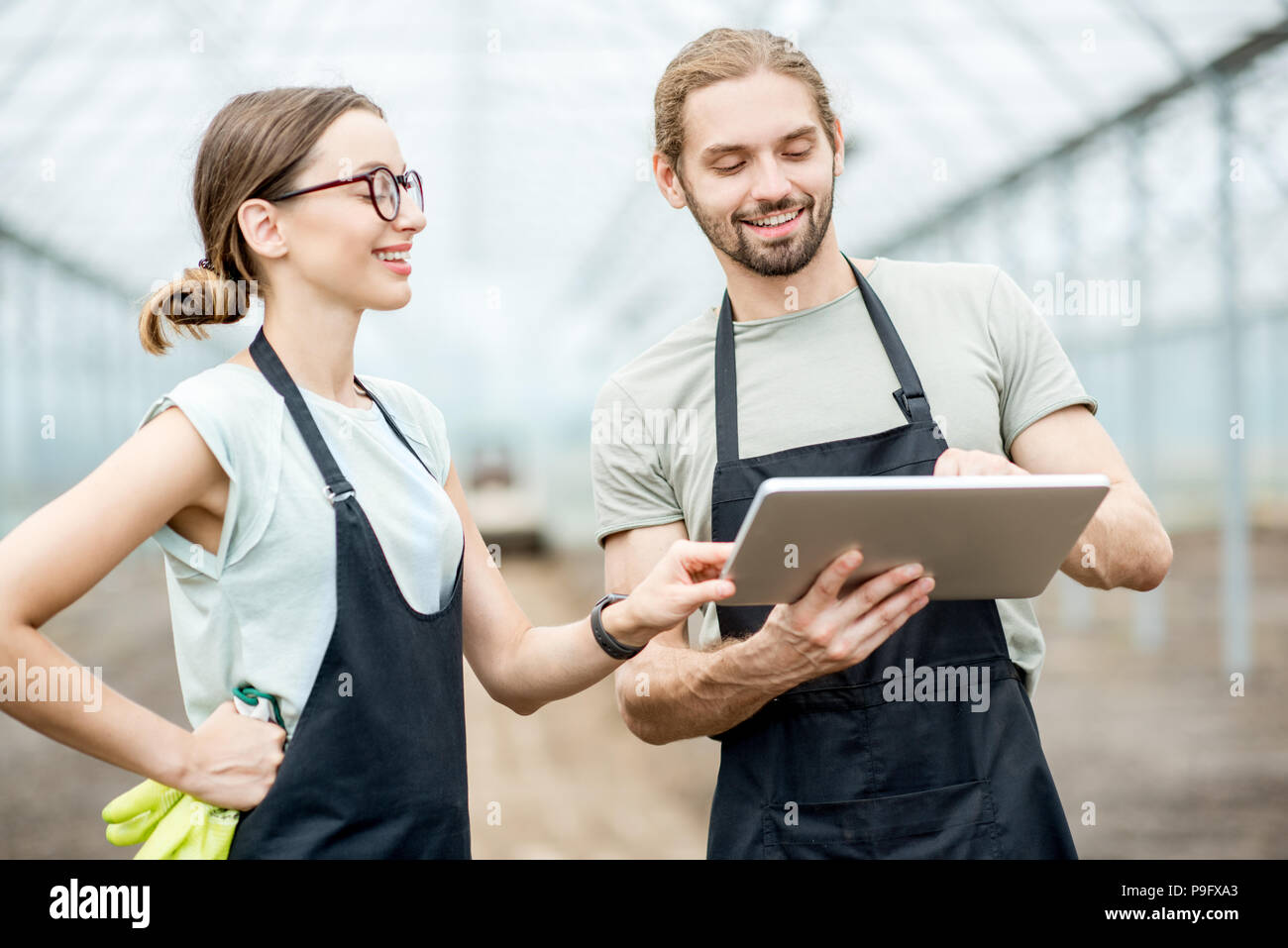 Two farmers using digital tablet hi-res stock photography and images ...