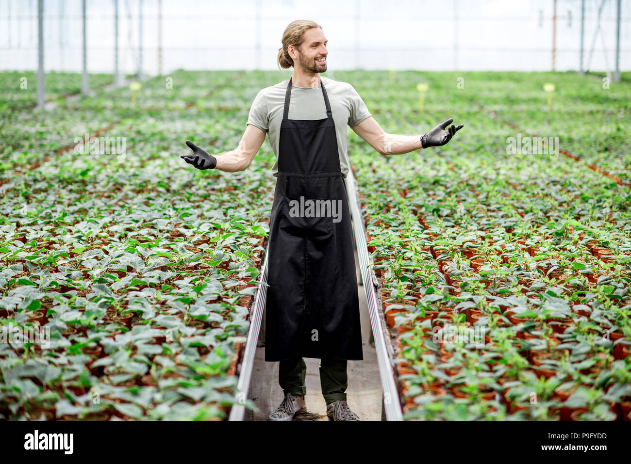 Happy owner of plant production Stock Photo - Alamy