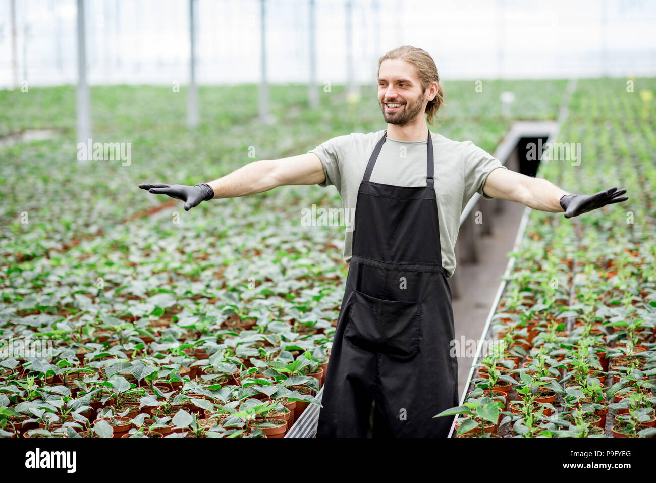 Happy owner of plant production Stock Photo - Alamy