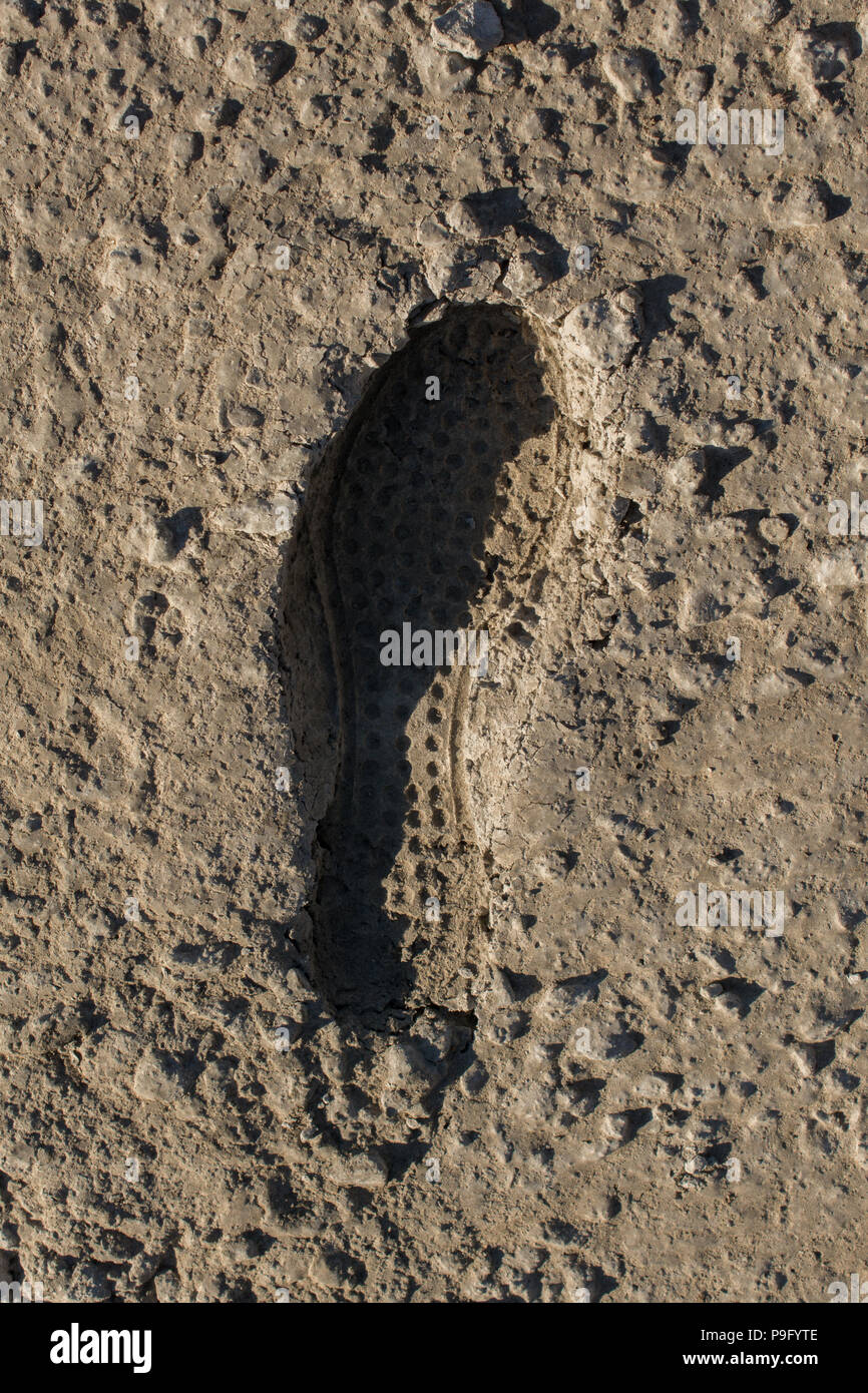 Footstep pattern seen on a concrete background Stock Photo - Alamy