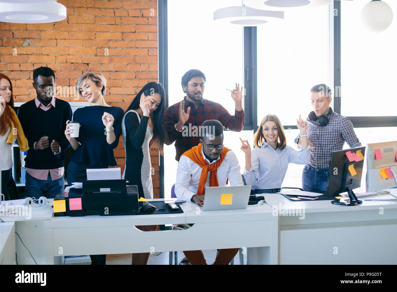 young diverse business people are having party at workplace while their ...