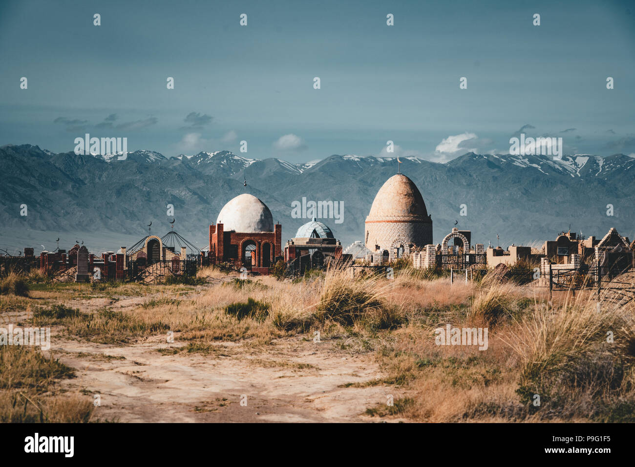 Central Asian muslim cemetery with old and new mausoleums together, in ...
