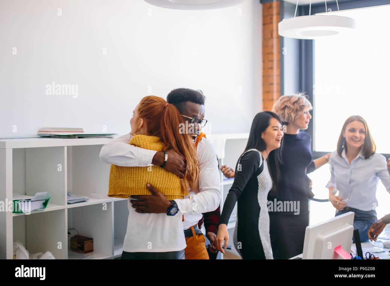 Men hugging and office hi-res stock photography and images - Alamy
