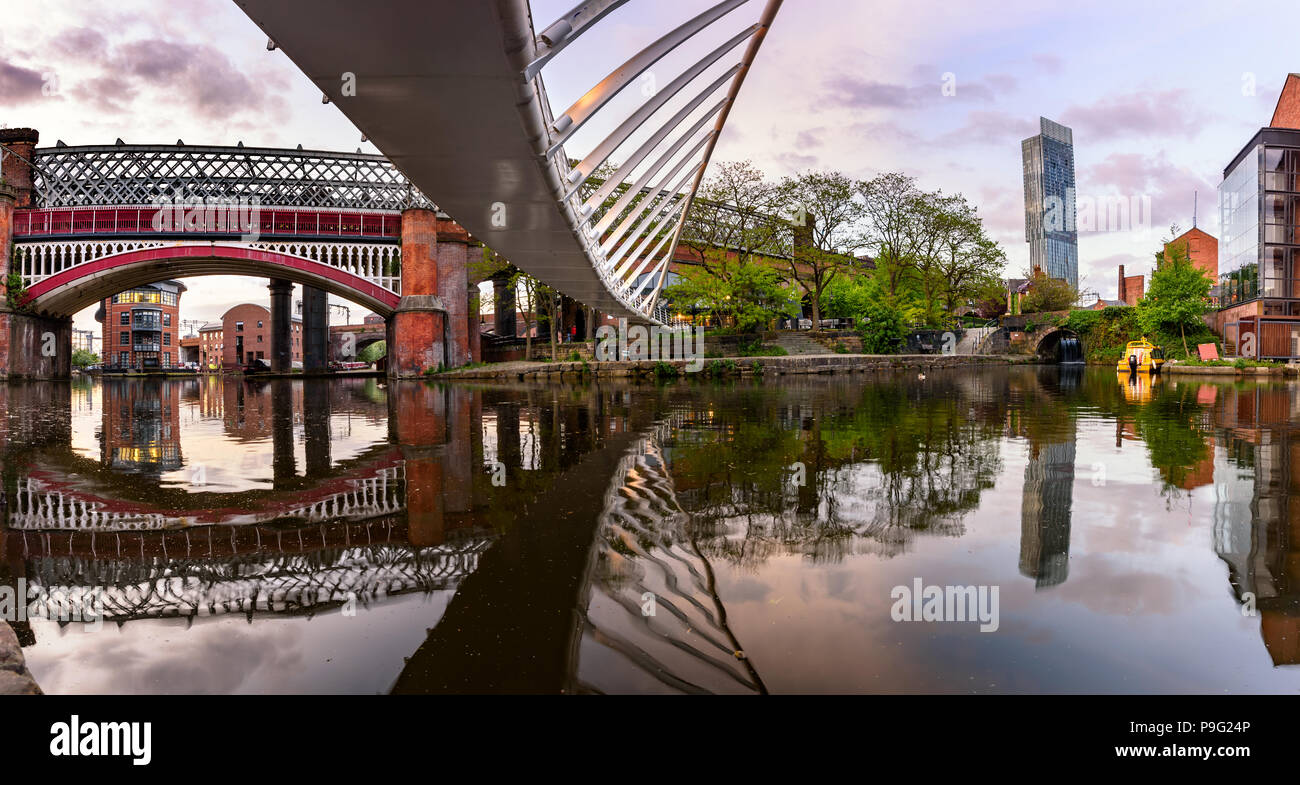 The canal basin at Castlefield is crossed by four large railway ...