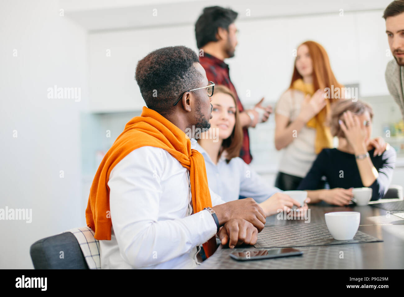 closeup cropped photo of dialogue between two men in the kitchen Stock ...