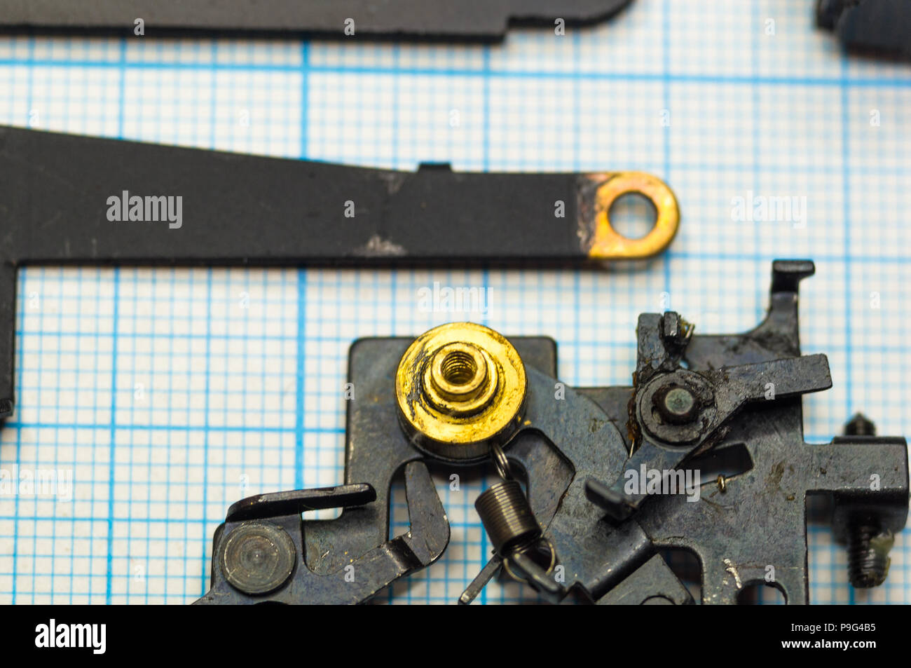 parts are completely disassembled old retro film SLR camera on graph ...