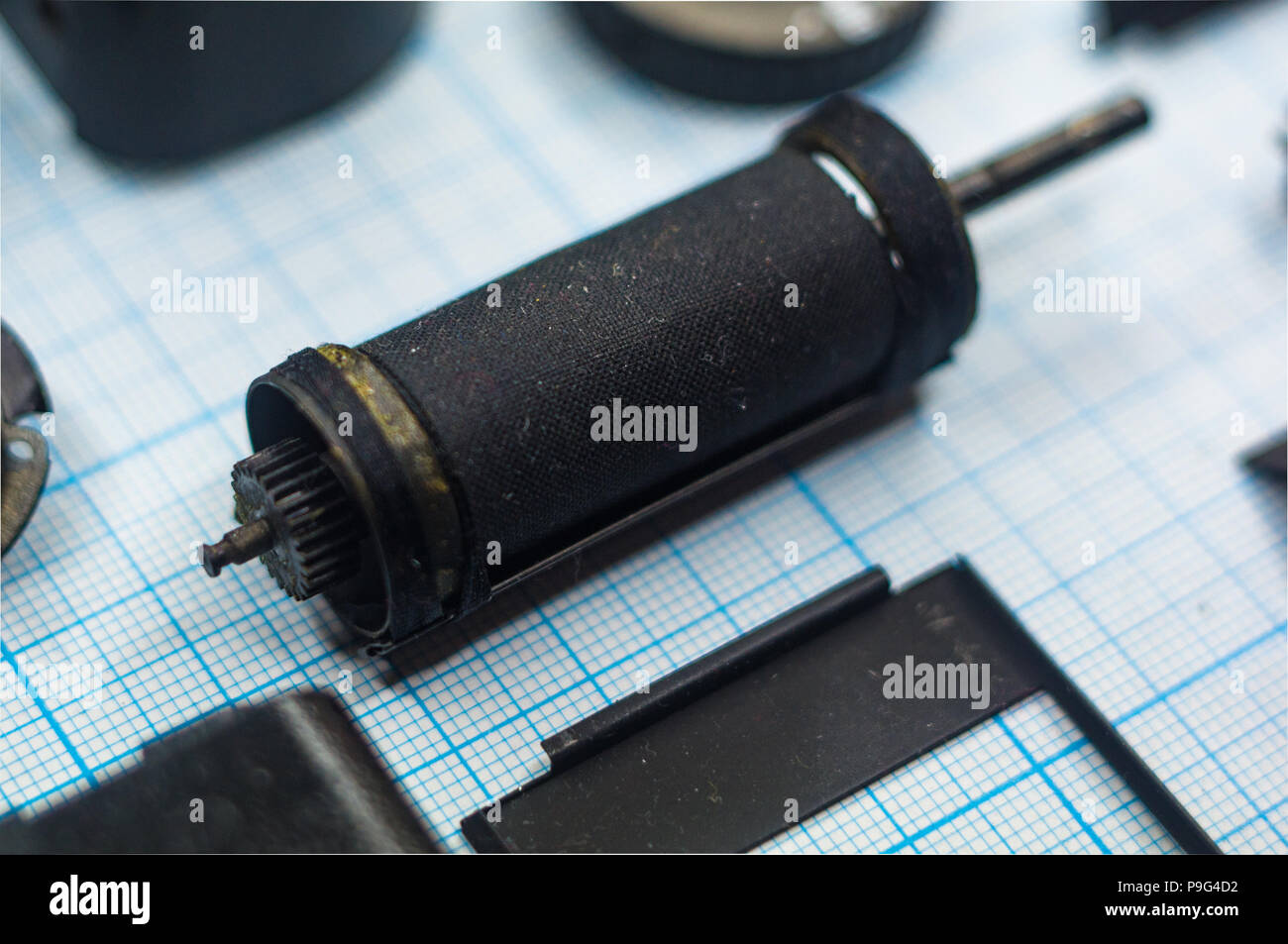 parts are completely disassembled old retro film SLR camera on graph ...