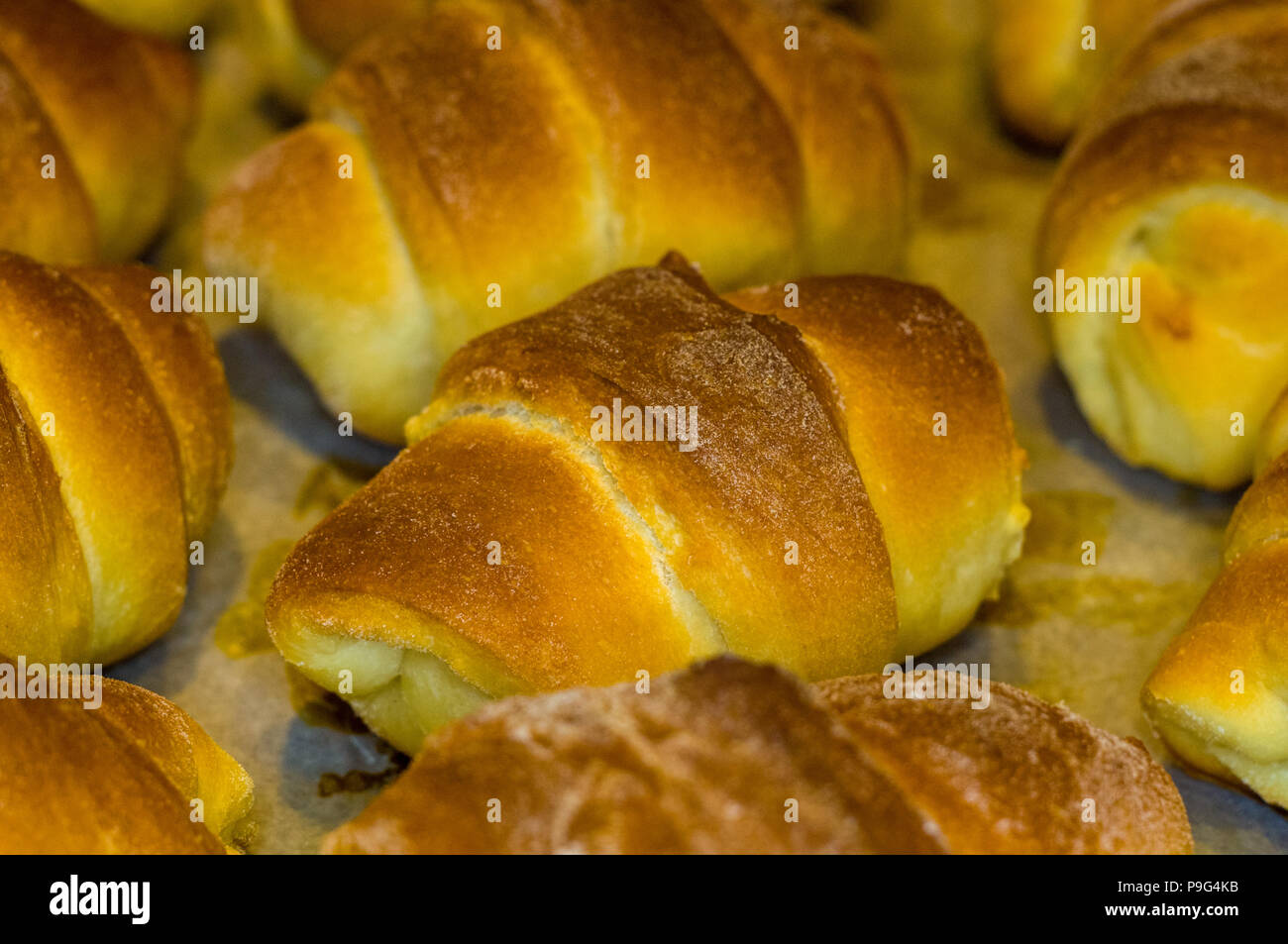 Fresh homemade croissants with sweet filling, before baking in the oven, selective focus Stock ...