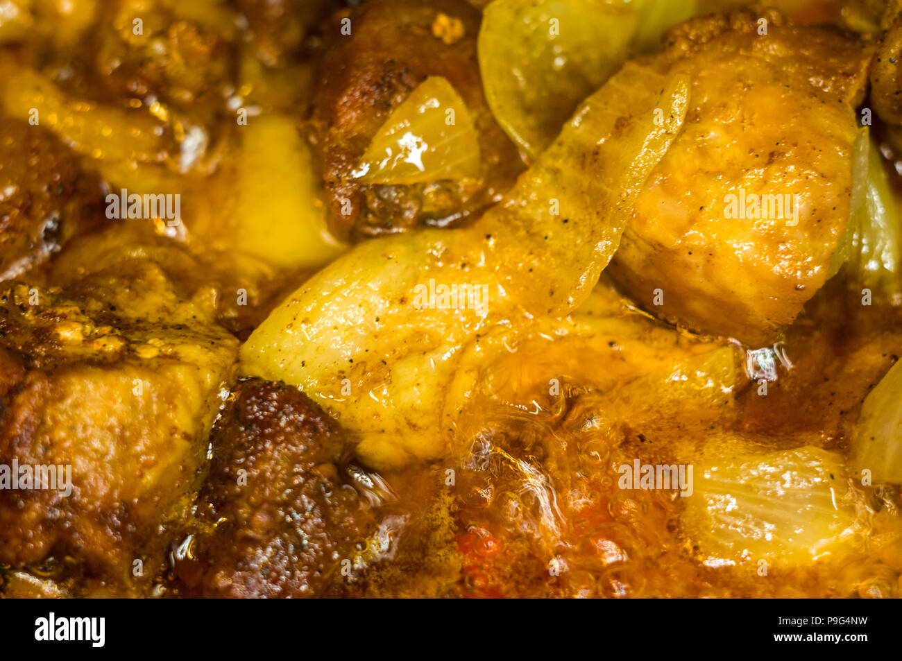 Roast meat, onions, carrots and spices, boiling in oil, homemade ...