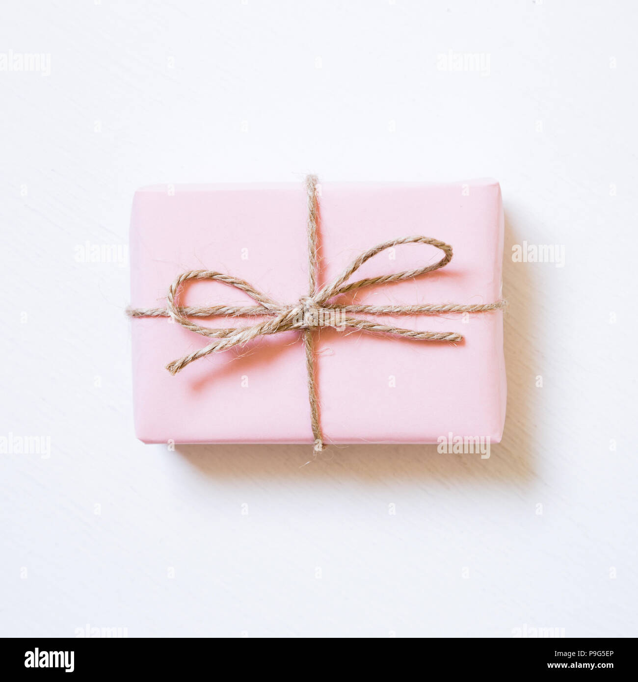 Pink color gift box on white background Stock Photo - Alamy