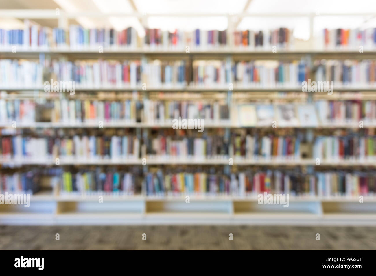 Tall, full library bookshelves, blurred out-of-focus background Stock ...