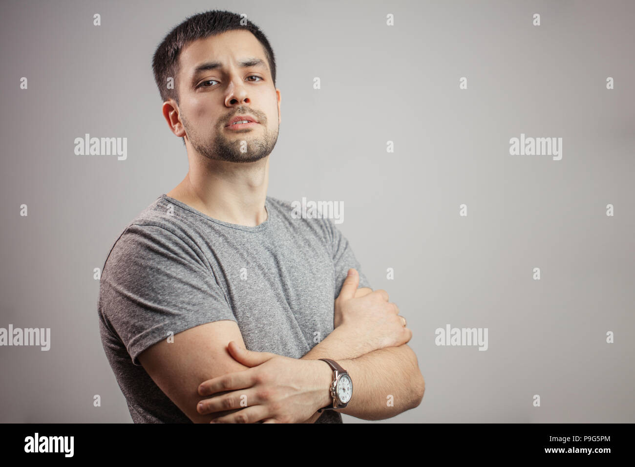 arrogant courageous man with muscular body. copyspace. close up side ...