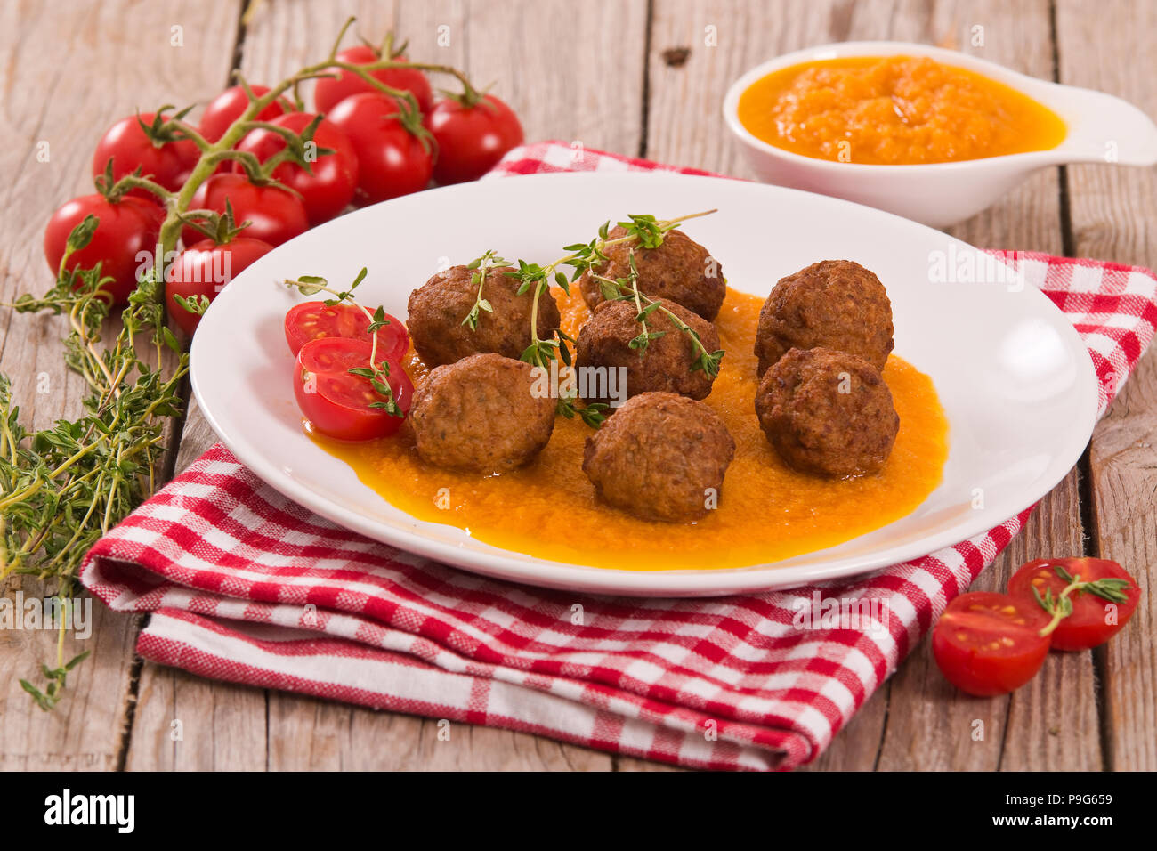 Meatballs with carrot purée Stock Photo - Alamy