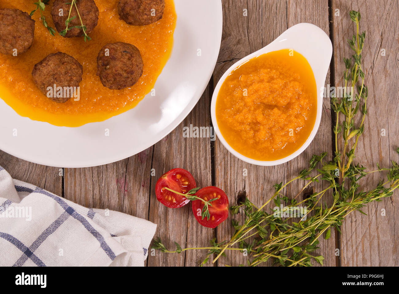 Meatballs with carrot purée Stock Photo - Alamy