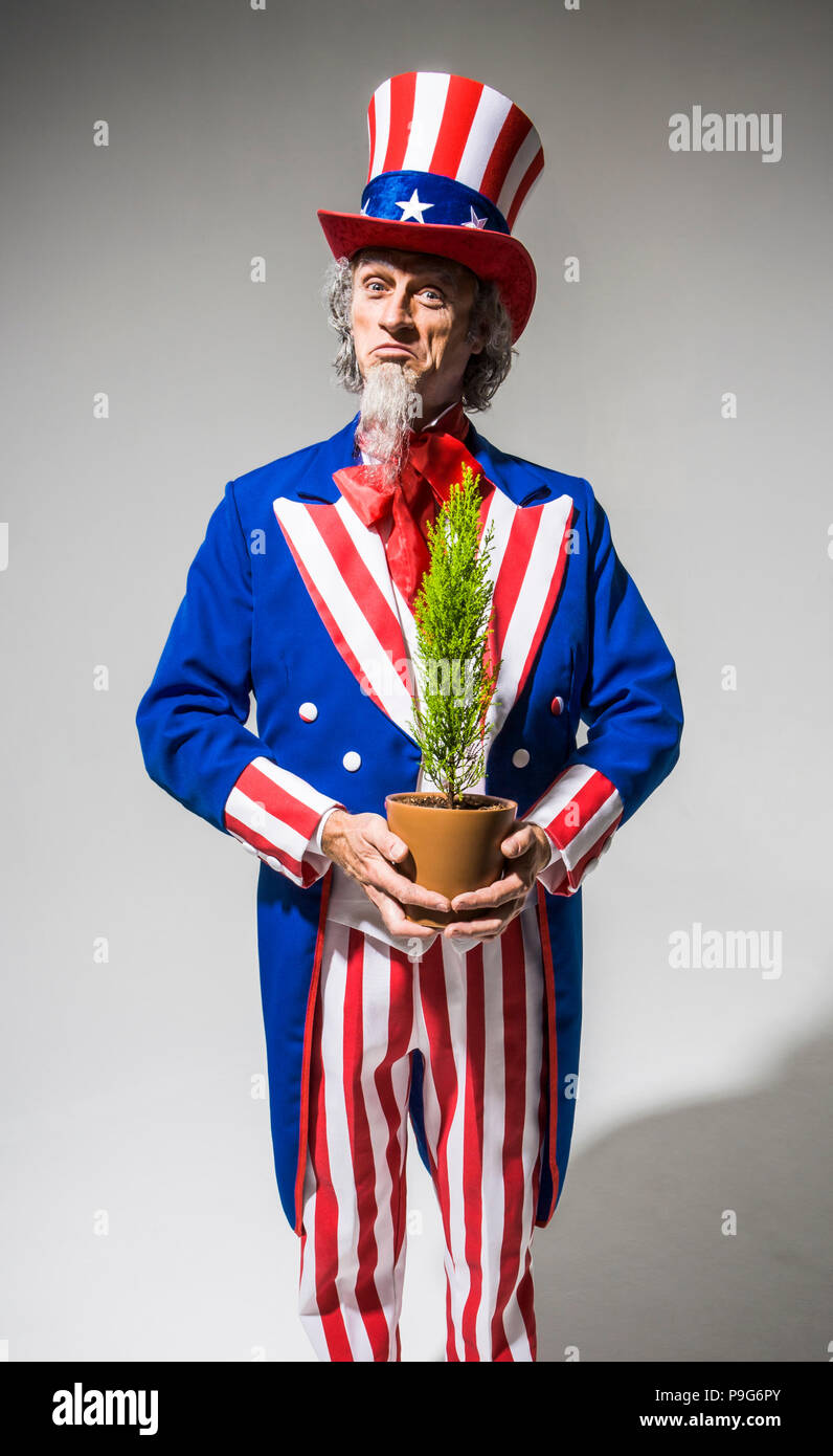 Uncle Sam character holding a small green potted plant / tree. Concept ...