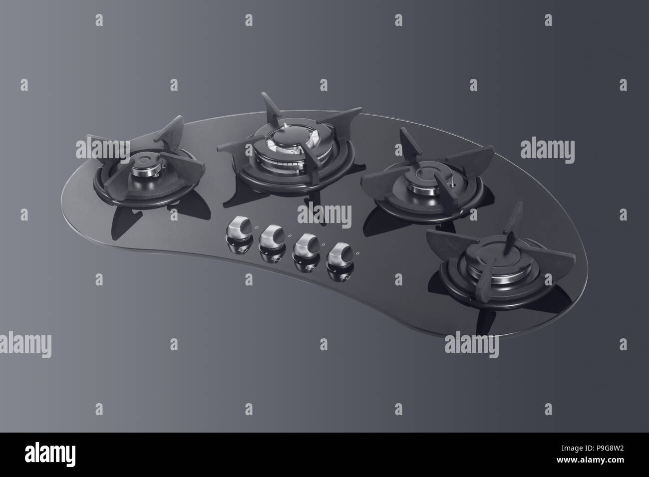 Kitchen tabletop gas hob in front of dark background, selection path ...
