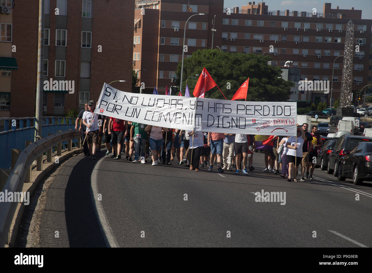 Protesters seen holding a huge banner and flags during the protest ...