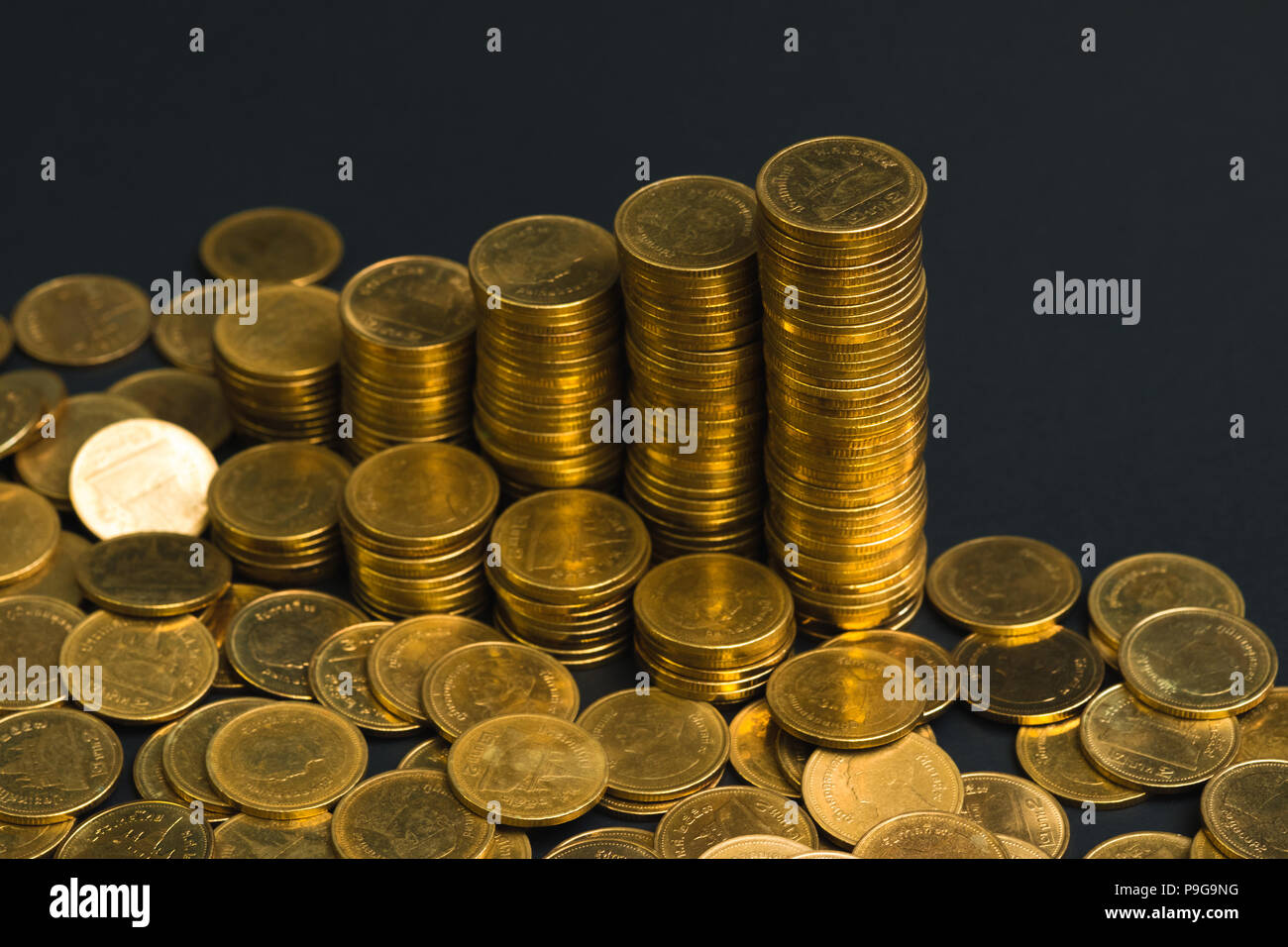 Savings, increasing columns of coins, piles of coins arranged as a ...