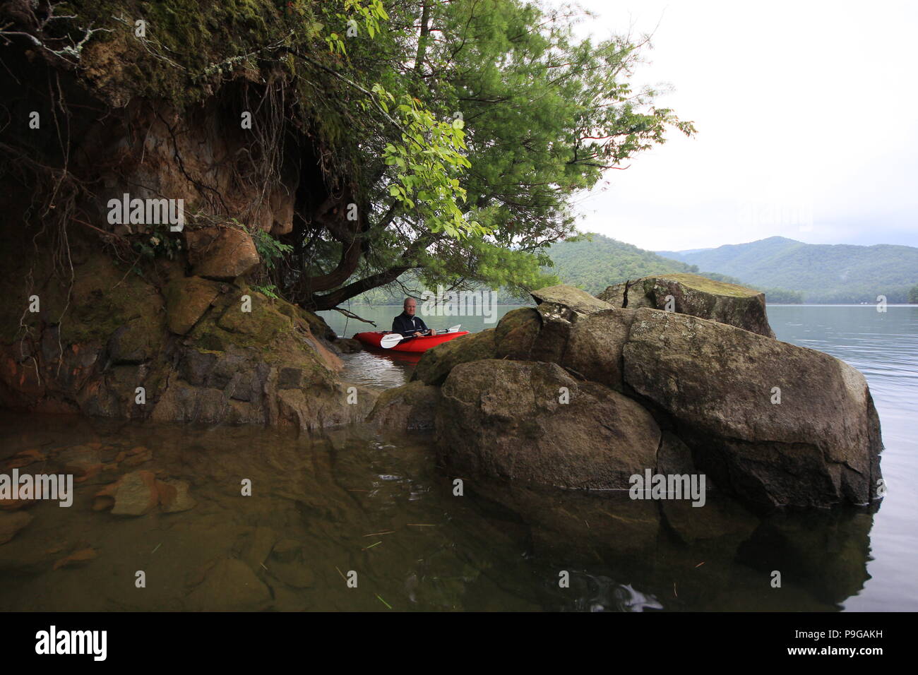 Kayaker on red kayak on Lake Santeetlah in North Carolina, United ...