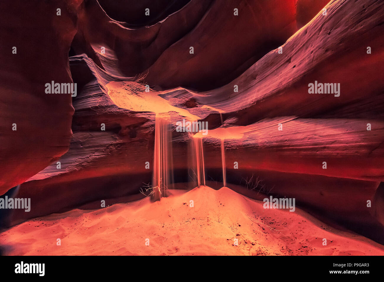 Waterfall effect created by falling sand from rocks in Antelope Canyon ...
