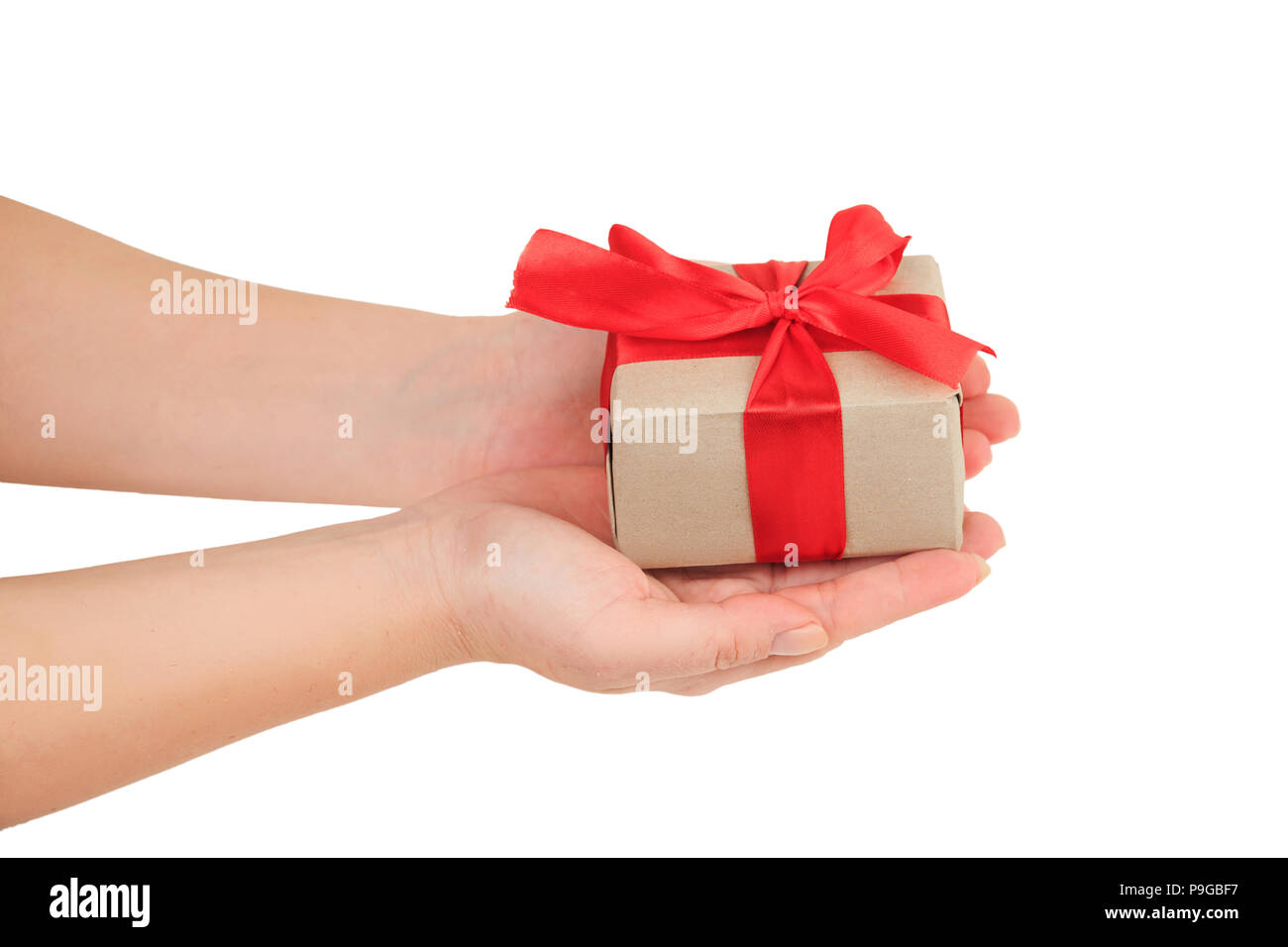 presentation of gift, female hands giving a gift wrapped with red ...