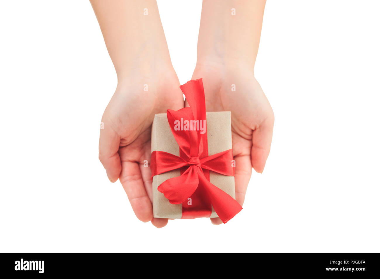 presentation of gift, hands giving a gift wrapped with red ribbon on ...