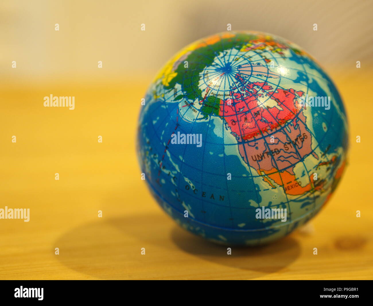 Close Up Mini Globe with Wooden Table Background Stock Photo - Alamy