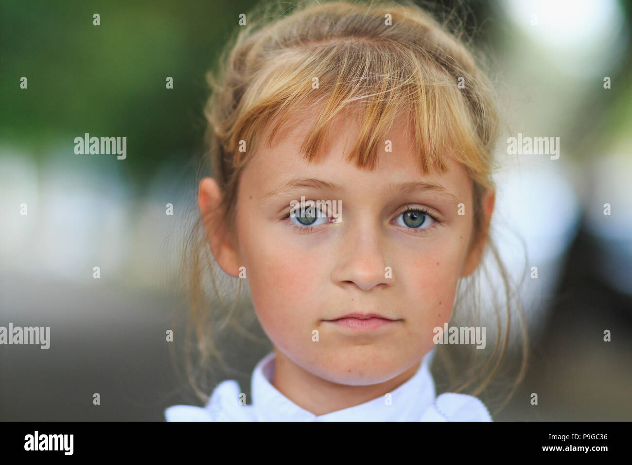 little girl's face closeup, kid's portrait, thoughtful or sad child Stock Photo - Alamy