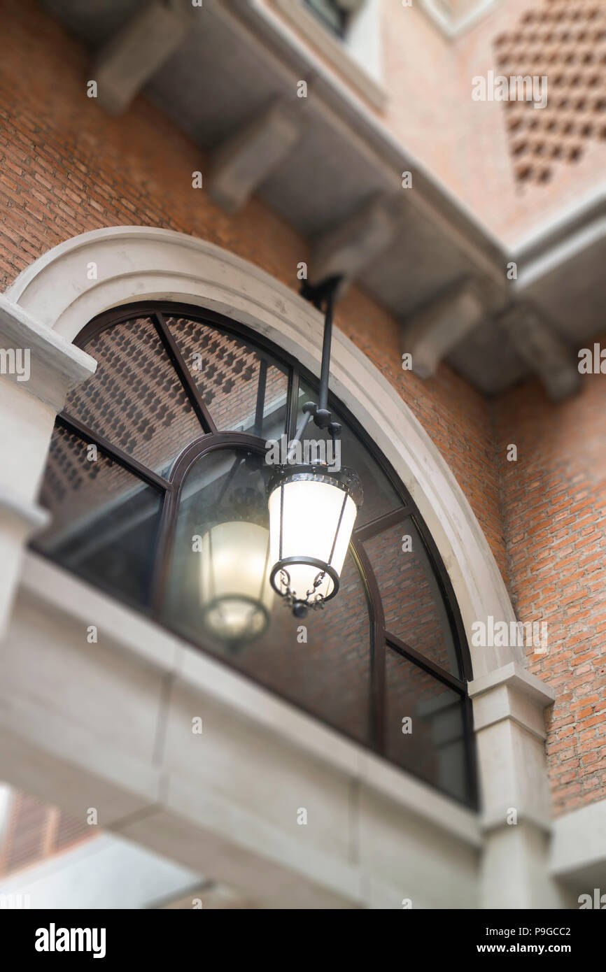 Brick wall building with light lamp, stock photo Stock Photo - Alamy