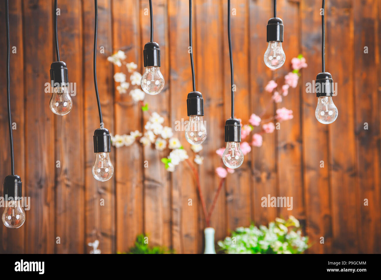 interior decoration, suspended lamps or lights on wooden background ...