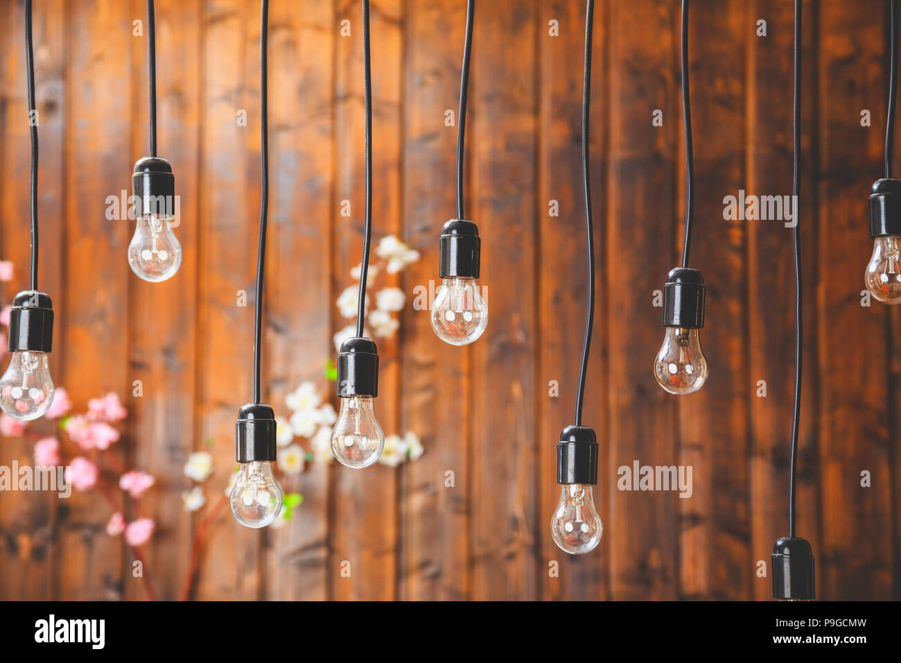 interior decoration, suspended lamps or lights on wooden background ...