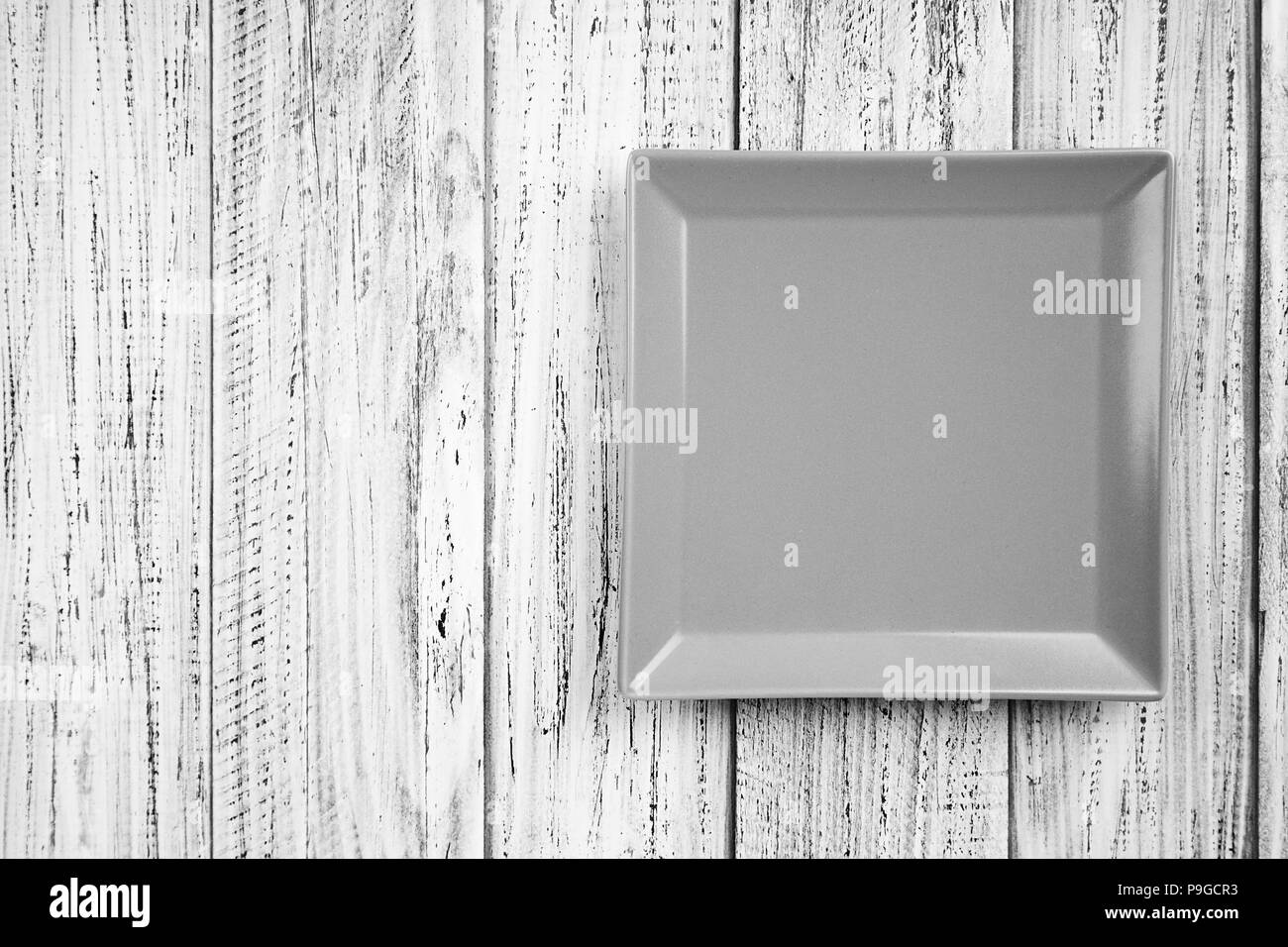 Empty wooden plate Black and White Stock Photos & Images - Alamy