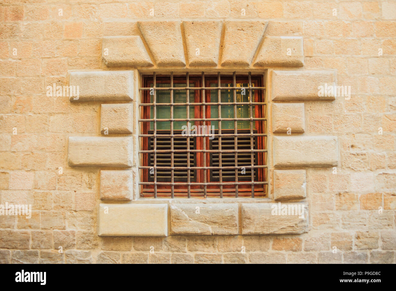 old window with bar on the stone wall Stock Photo - Alamy