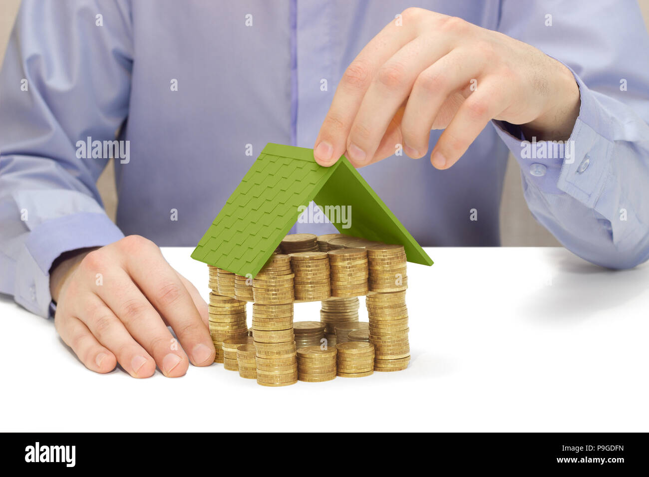 house, coin, hand Stock Photo - Alamy