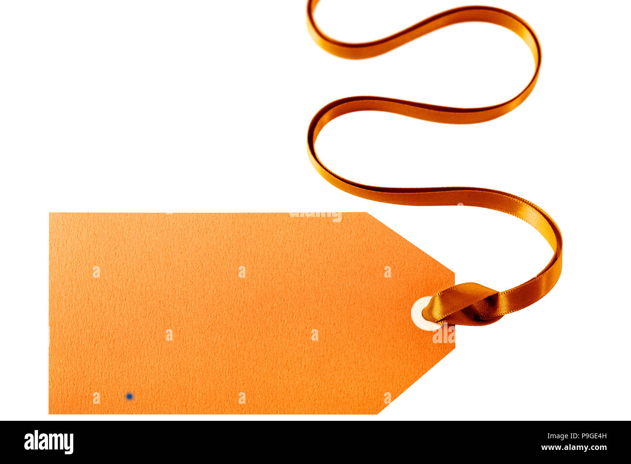 Gold gift tag tied with curly ribbon isolated on white Stock Photo - Alamy