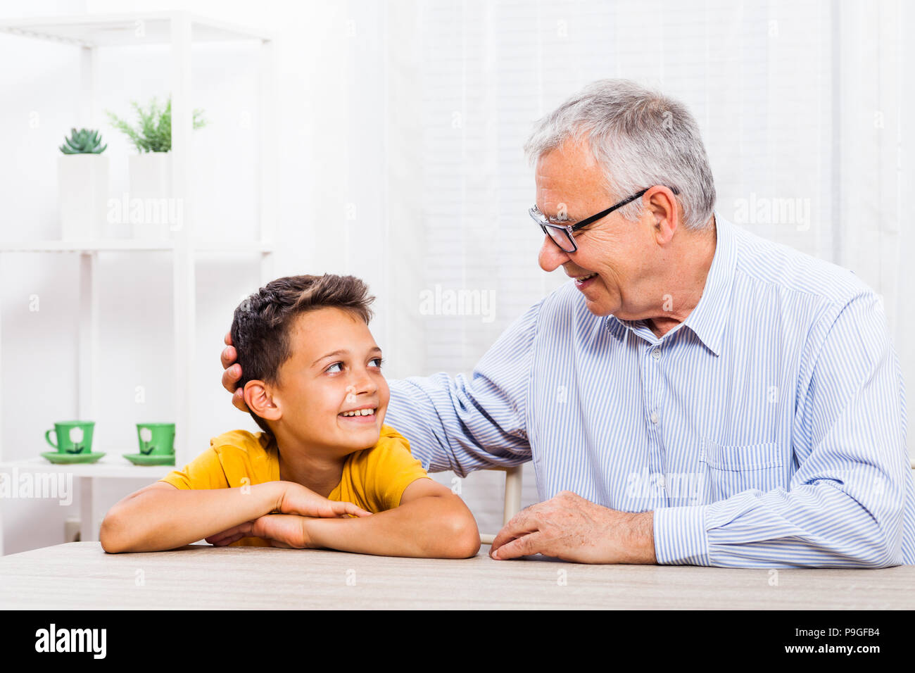 Happy grandfather and grandson at home Stock Photo - Alamy
