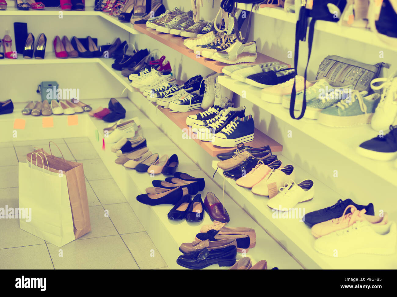 Picture of shelves with sneakers in the shoes store Stock Photo - Alamy