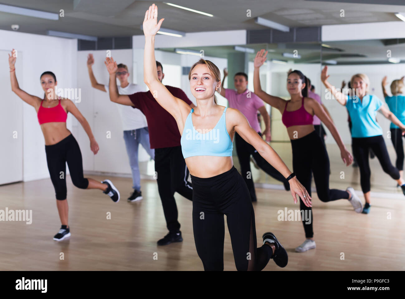 Smiling different ages adults training swing steps at dance class Stock ...