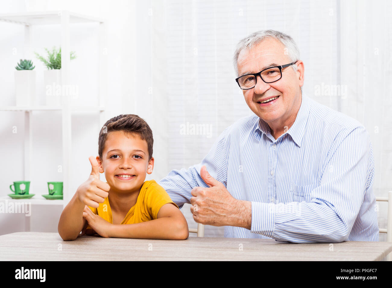 Happy grandfather and grandson at home Stock Photo - Alamy