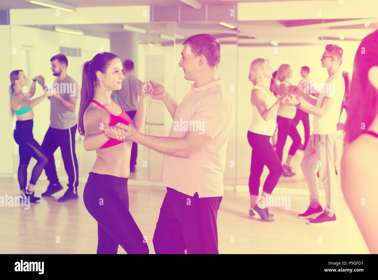 Joyful dancing pair dance tango together in studio Stock Photo - Alamy