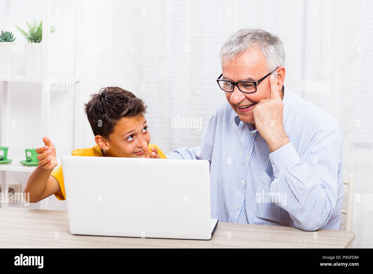 Grandfather with computer hi-res stock photography and images - Alamy