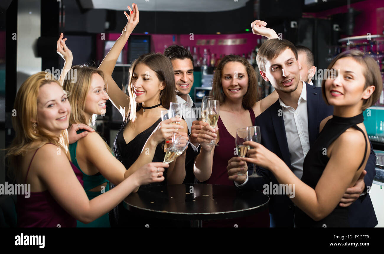 Smiling colleagues dancing on corporate party with cocktails Stock ...