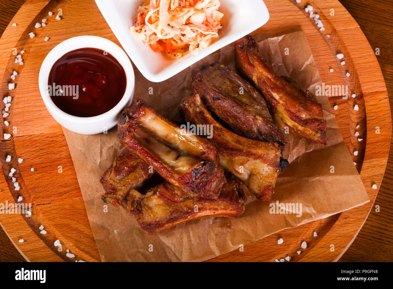Pork ribs with sauce and cabbage Stock Photo - Alamy